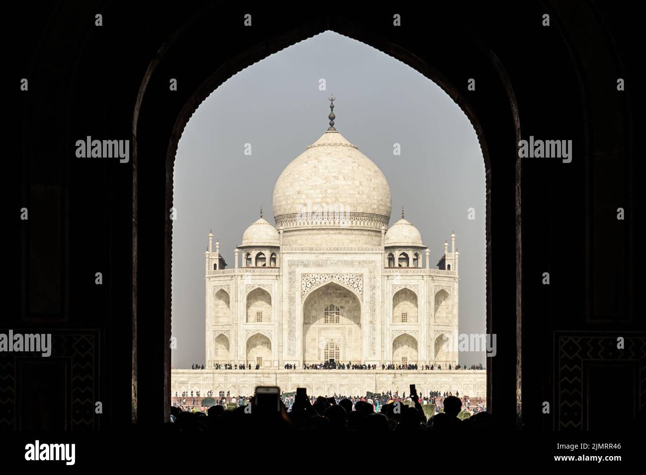 Taj Mahal which is visible from the large tower gate (India, Agra Stock ...