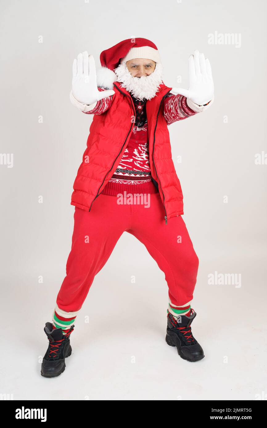 Christmas holidays concept. Cheerful Santa Claus shows stop gesture ...