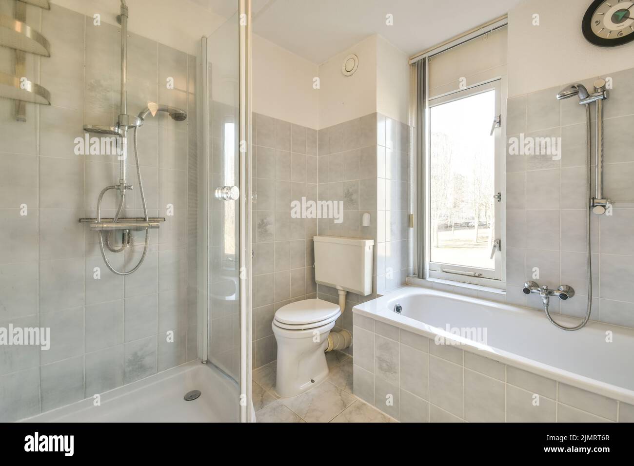 Modern home interior design of white bathroom with open bathtub and ...