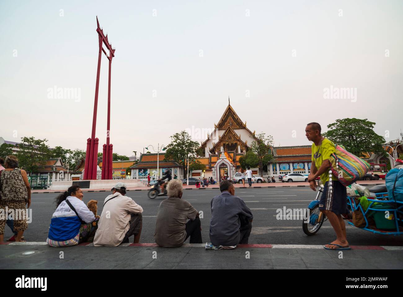 People sitting in Giant Swing at night. The Giant Swing was constructed ...