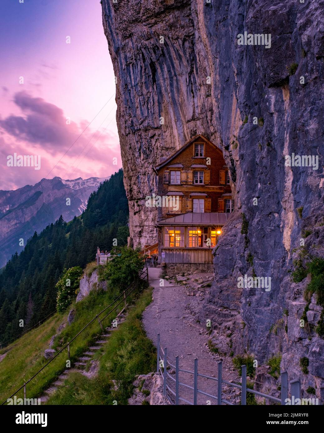 Swiss Alps and a mountain restaurant under the Aescher cliff viewed ...