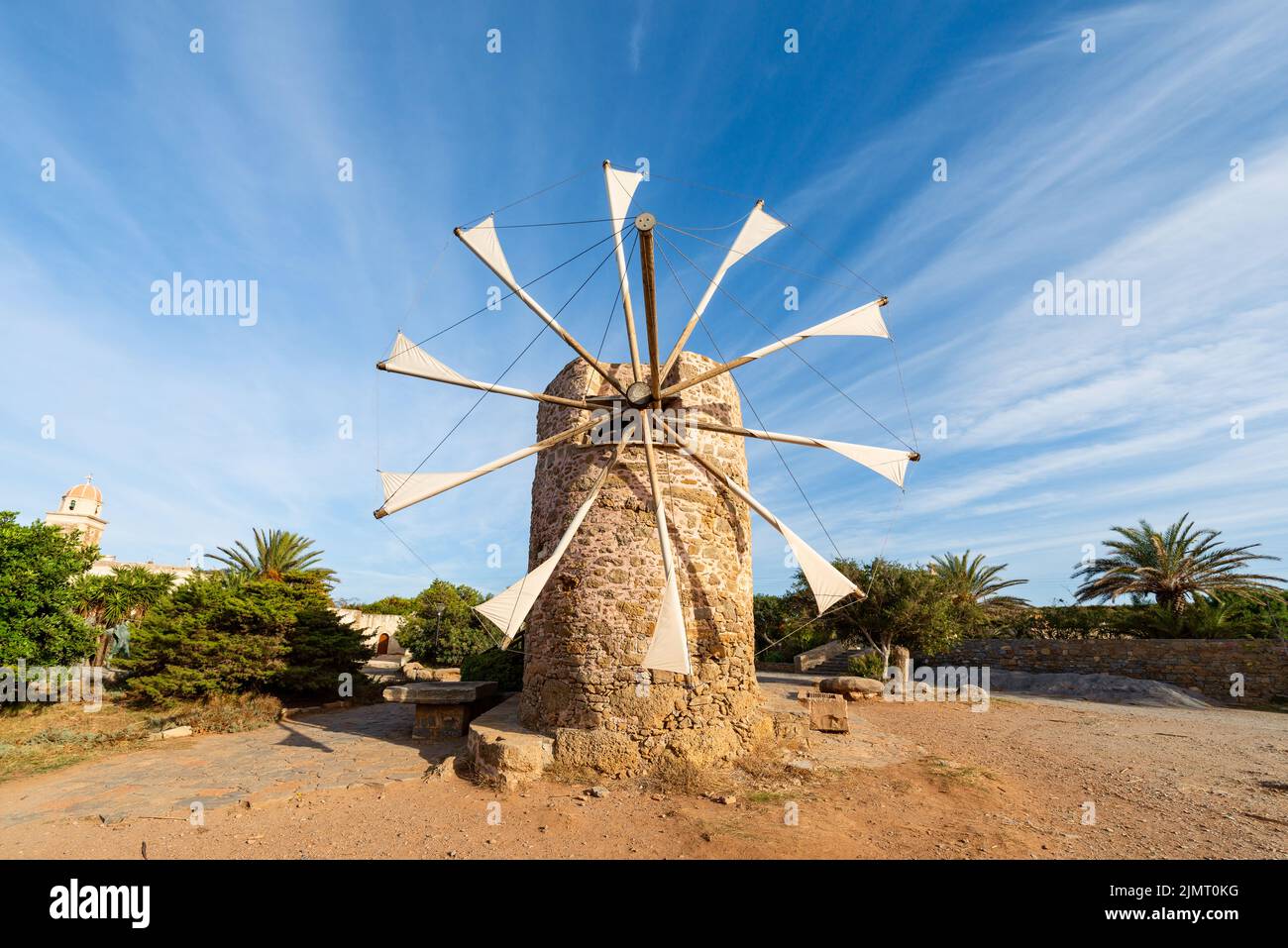 A windmill on the island of Crete in Greece with a beautiful skyscape ...
