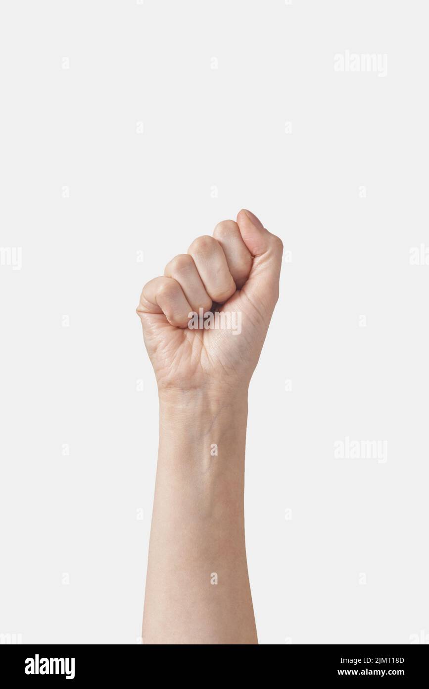 Female hand in strong fist gesture on white Stock Photo - Alamy