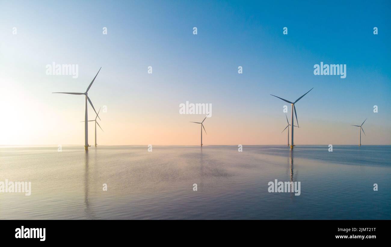 Windmill park in the ocean, drone aerial view of windmill turbines ...