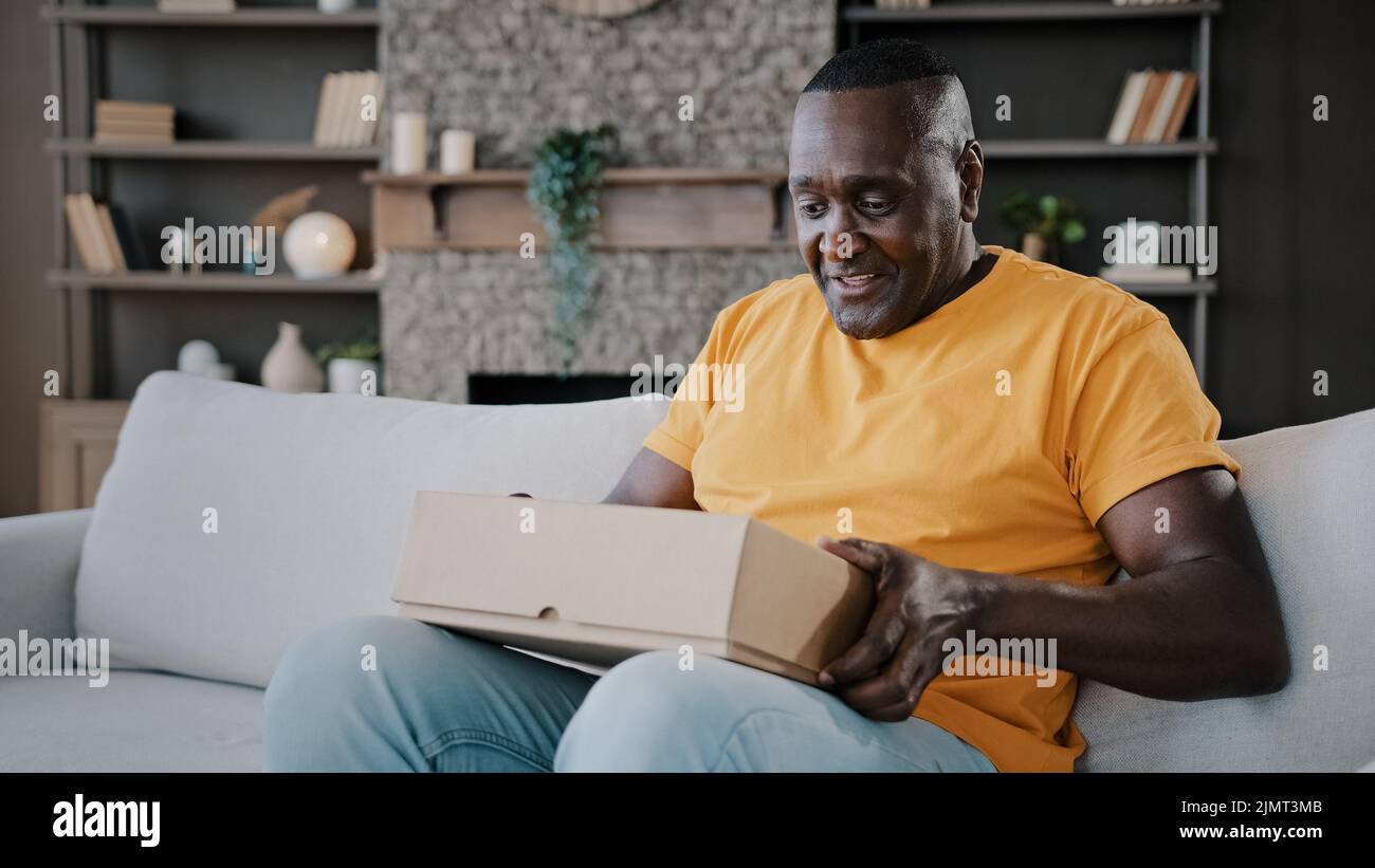 African man unpacking store hi-res stock photography and images - Alamy
