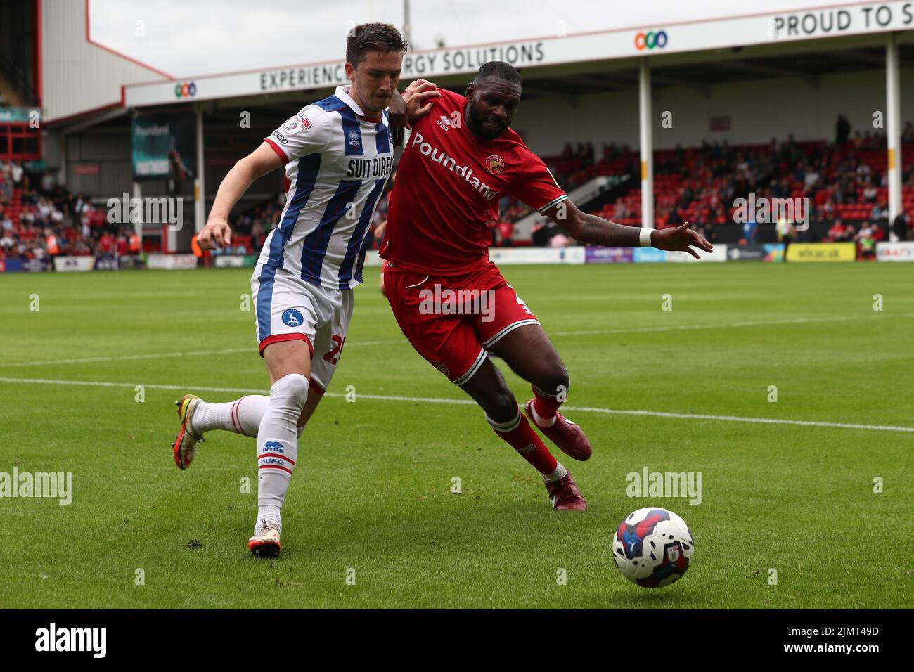 Alex Lacey of Hartlepool United in action with Wallsall's Hayden White ...
