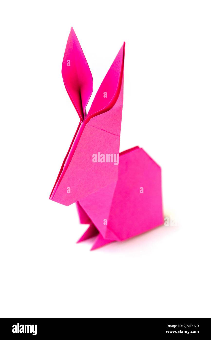 Pink paper rabbit origami isolated on a white background Stock Photo ...