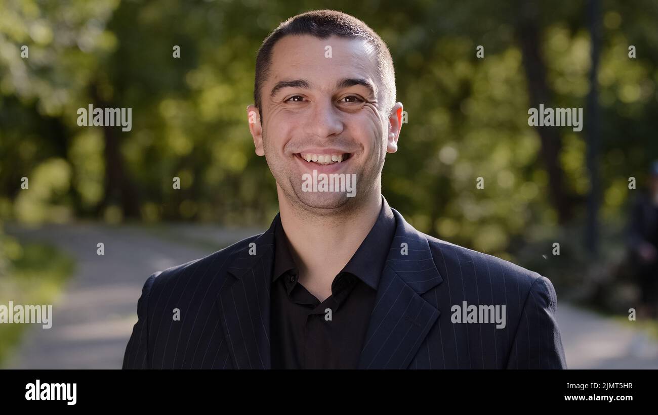 Male smiling portrait outdoors adult man guy stand outdoors wears black ...