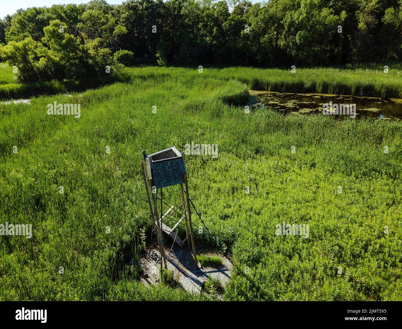 An old and broken hunting stand is left to rot away in the rural ...