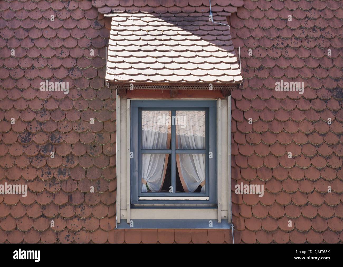 ancient traditional dormer window on the roof Stock Photo - Alamy
