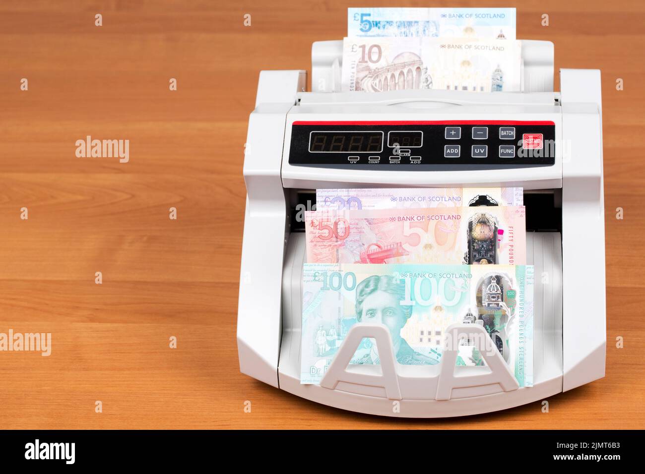 Scottish money - Pounds in a counting machine Stock Photo - Alamy