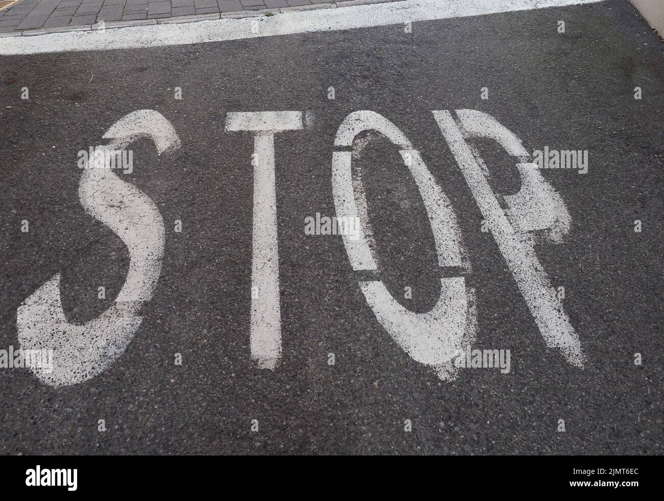 Regulatory signs, stop traffic sign on tarmac Stock Photo - Alamy