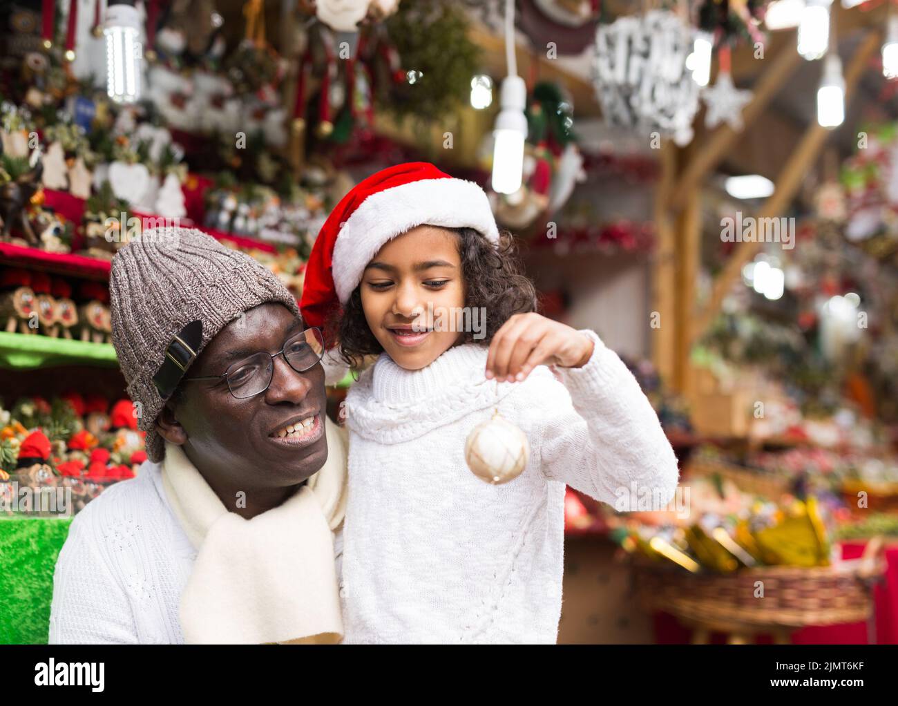 African american man with daughter in buying Christmas decoration Stock ...