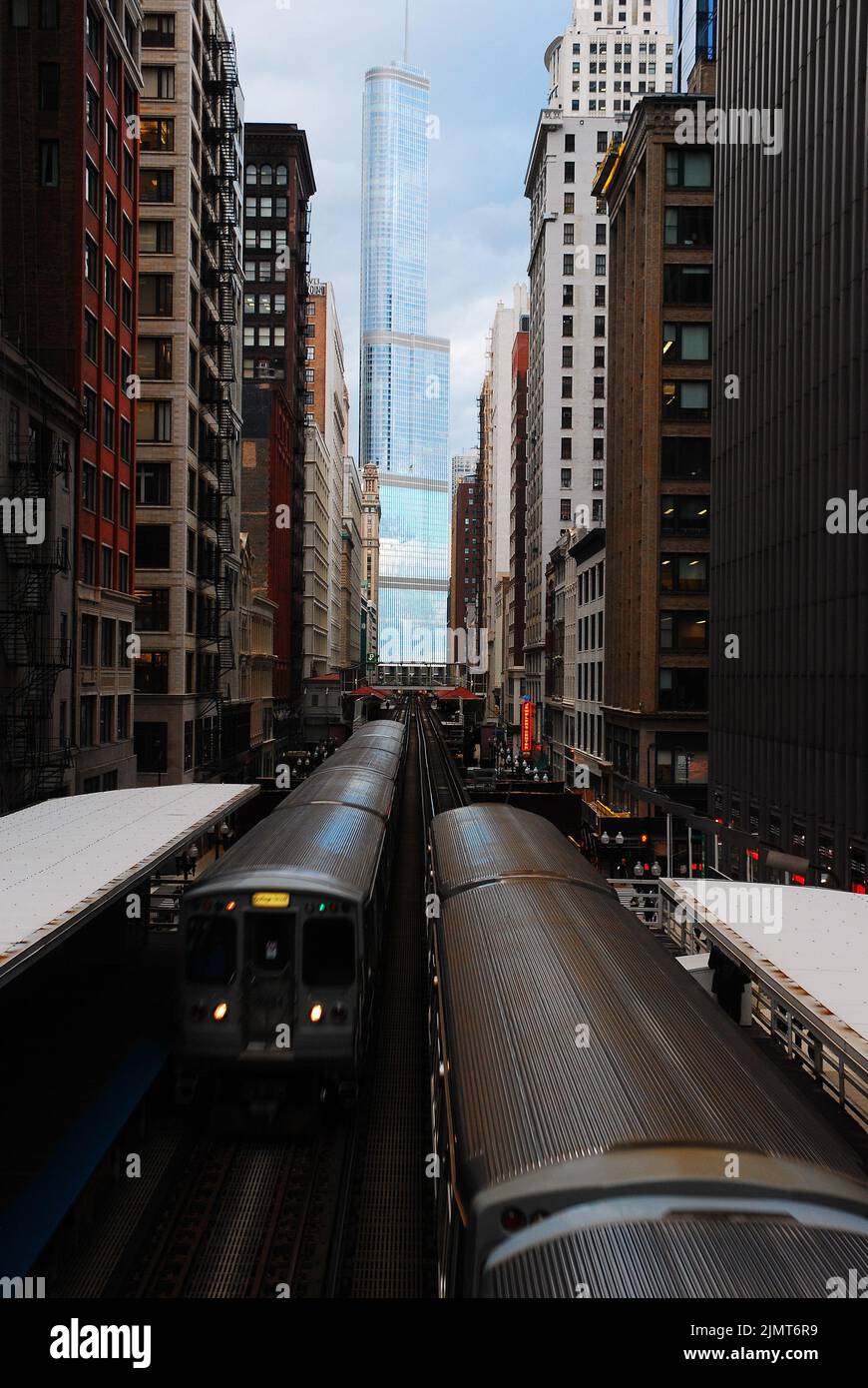 Two L Trains pulls into a station in the Loop of downtown Chicago Stock ...