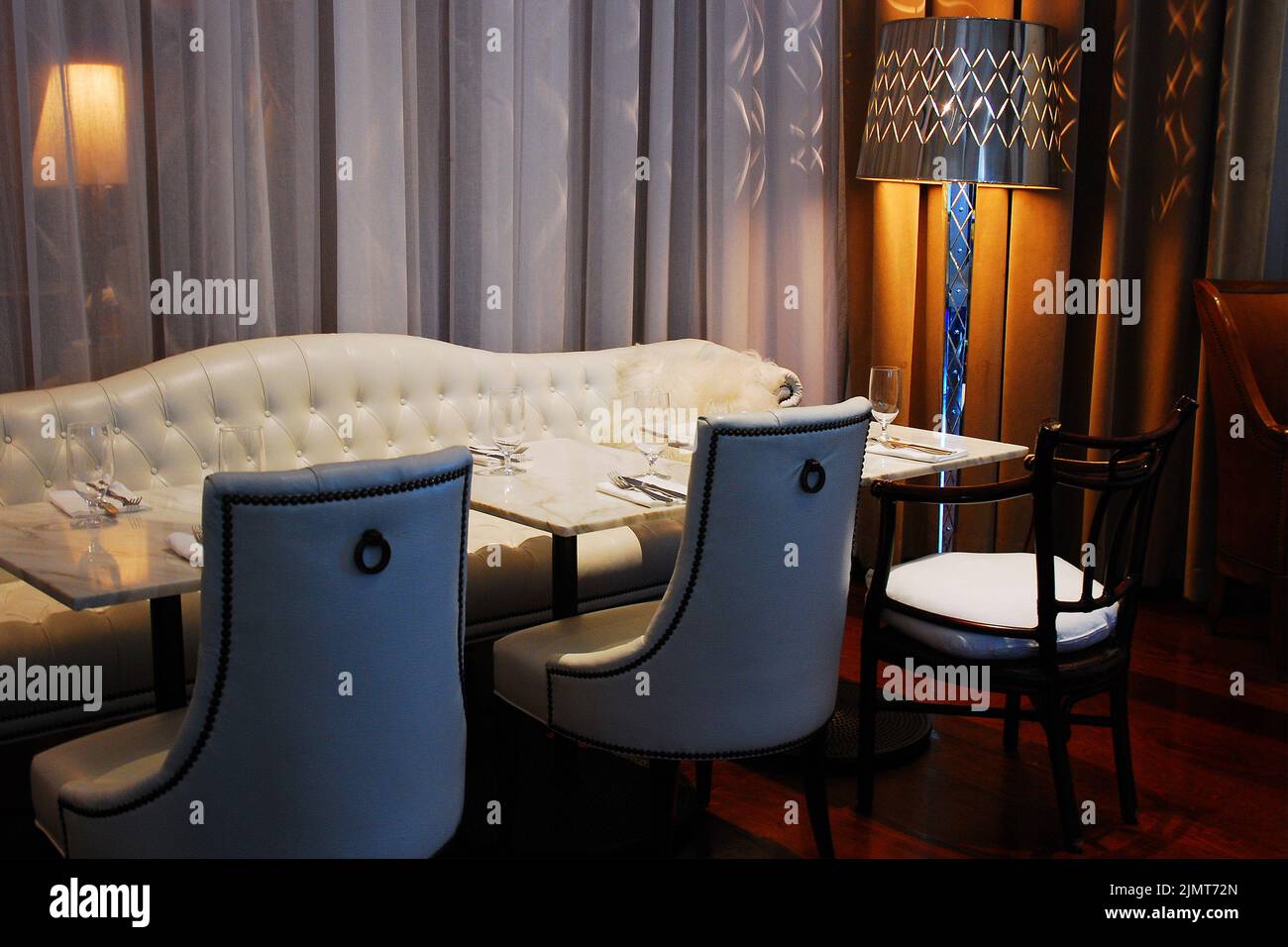 Elegant place settings and Art Deco design highlight the restaurant and ...