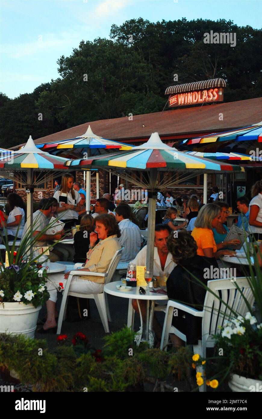 Restaurant customers and patrons enjoy an al fresco meal while dining ...