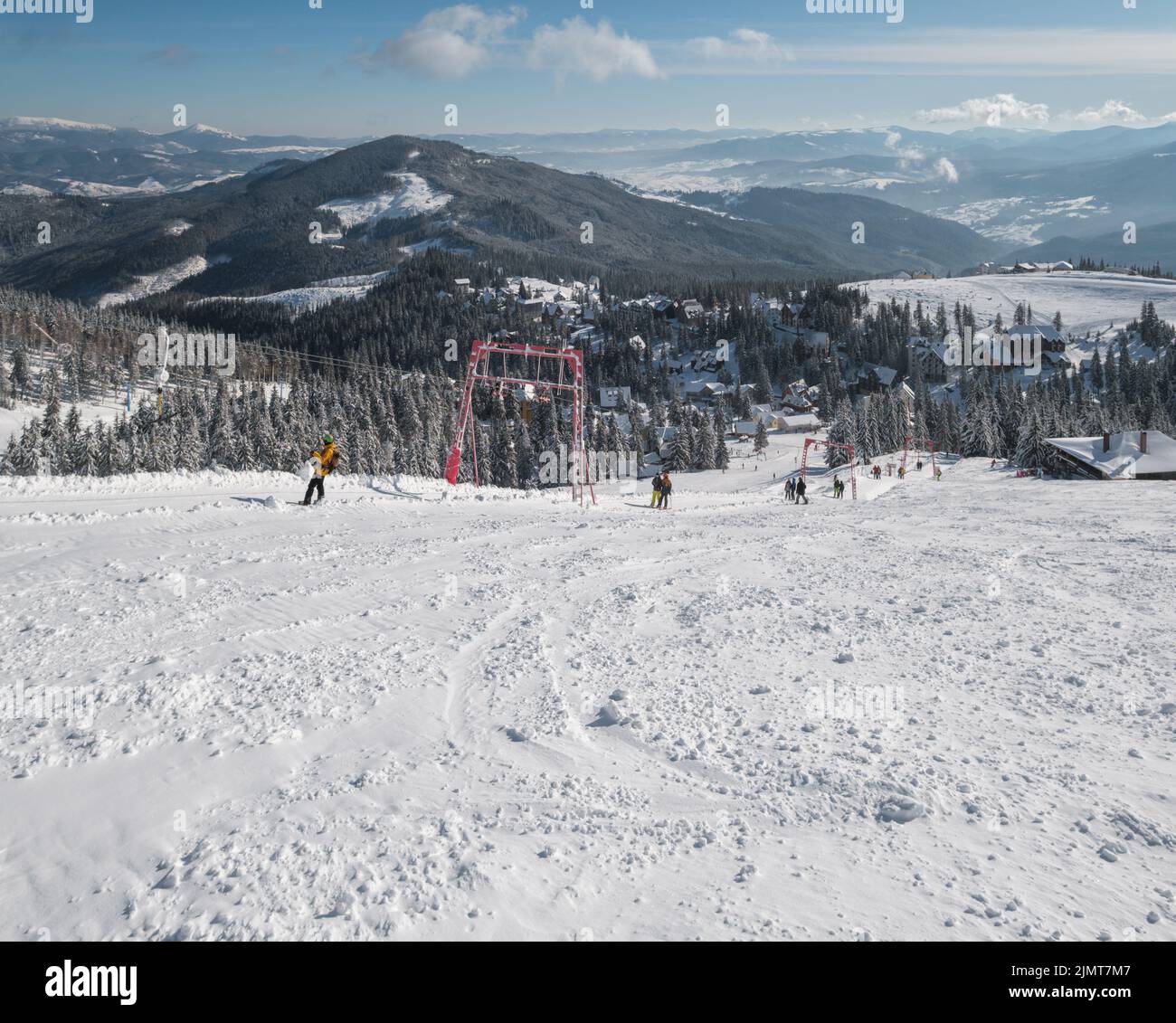 Winter snow covered mountain ski resort slope . Magnificent sunny day ...