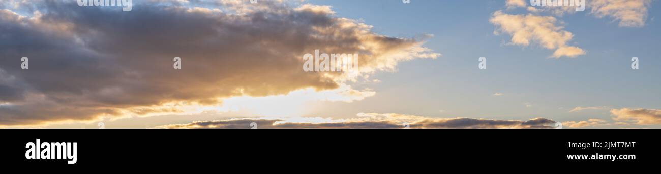 Clouds in evening dusk sky panoramic view. Climate, environment and ...