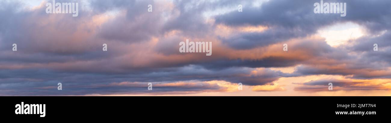 Clouds in evening dusk sky panoramic view. Climate, environment and ...