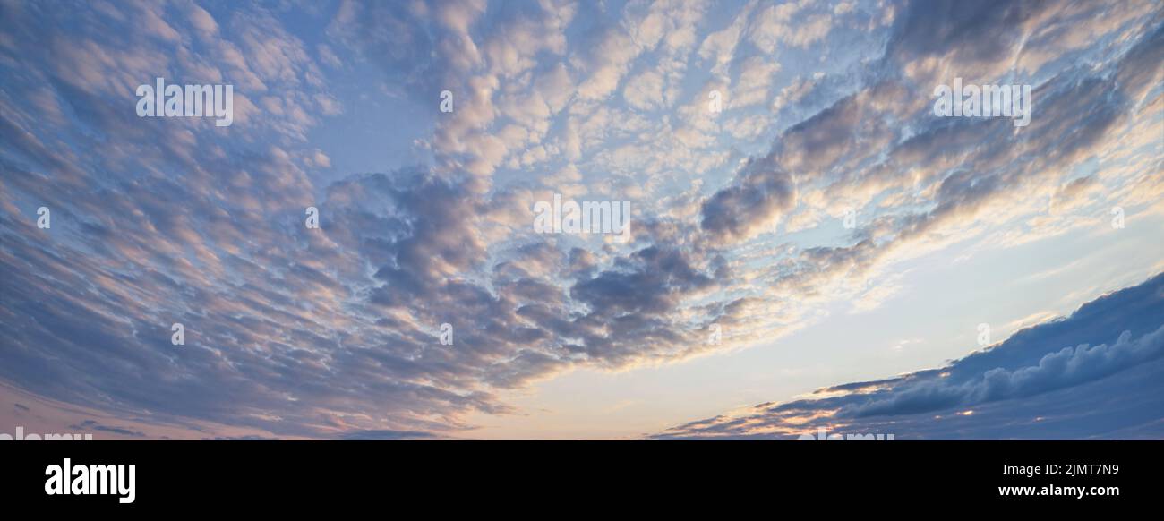 Clouds in evening dusk sky panoramic view. Climate, environment and ...