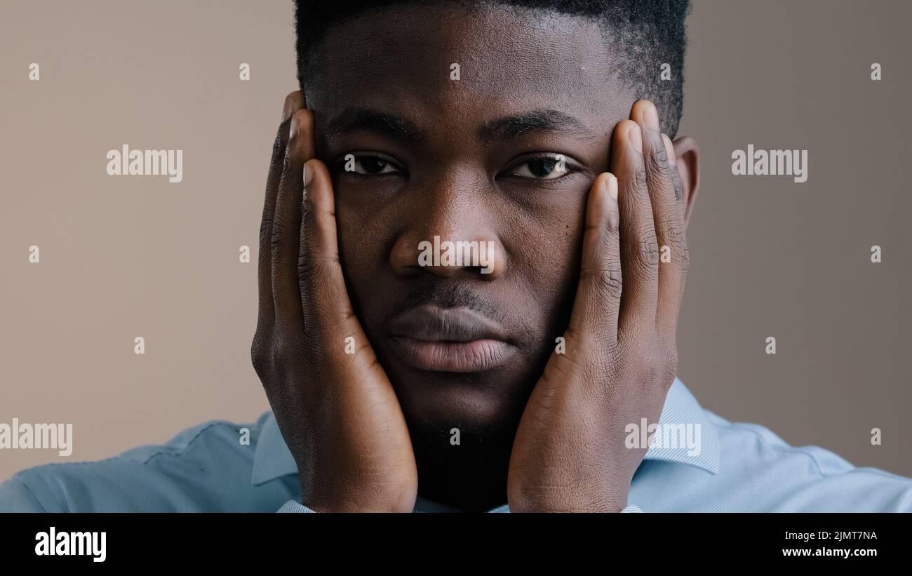 Portrait of sad african american man put hands on head sick ill tired ...