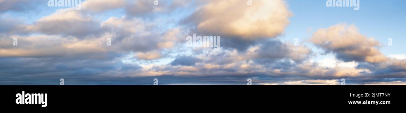Clouds in evening dusk sky panoramic view. Climate, environment and ...