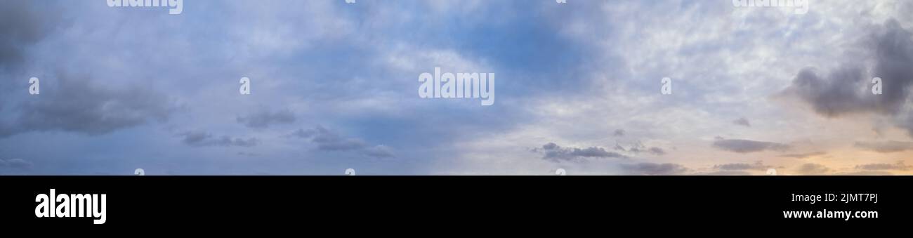 Clouds in evening dusk sky panoramic view. Climate, environment and ...