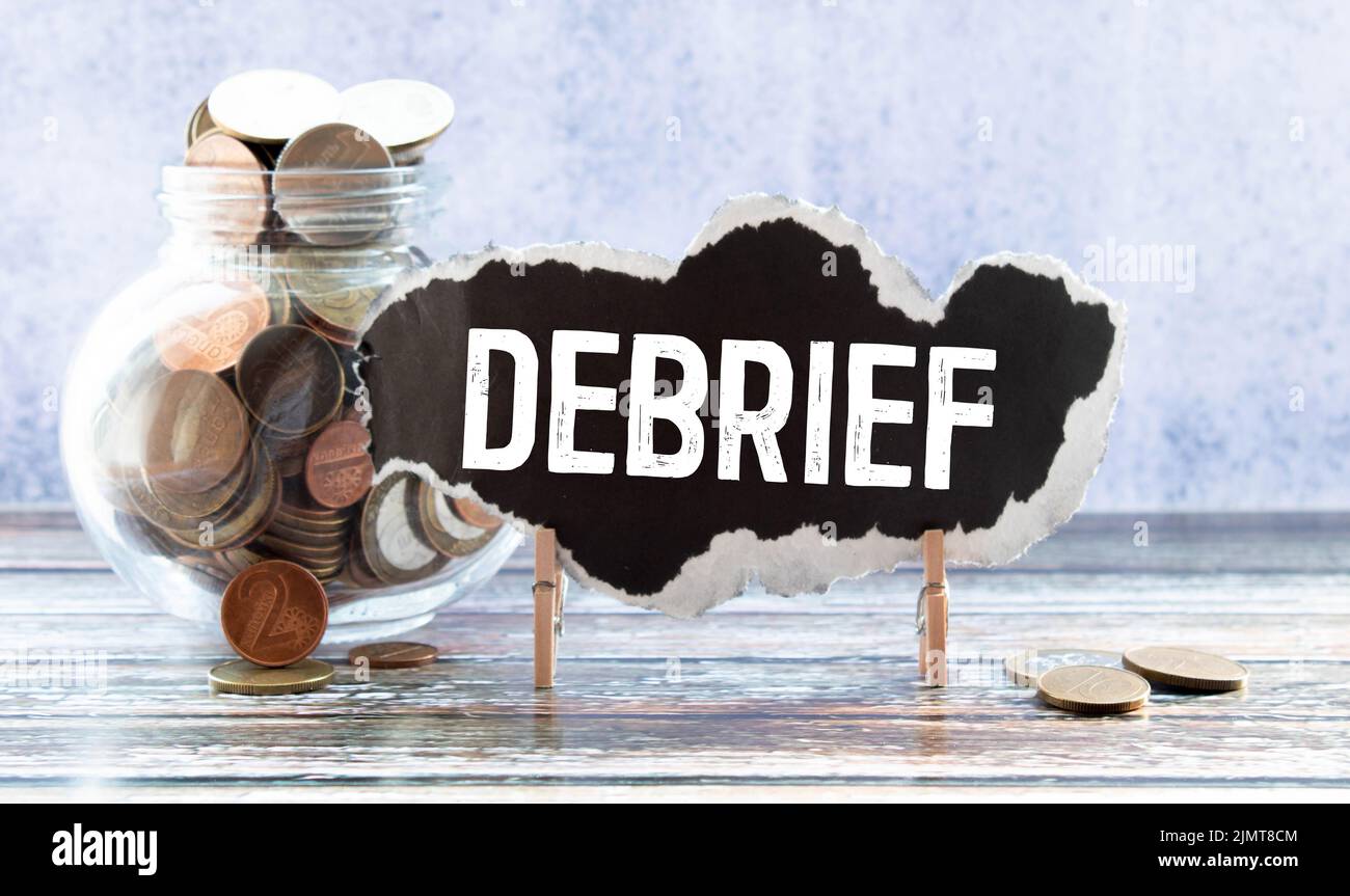 debrief word in a dictionary. debrief concept Stock Photo - Alamy