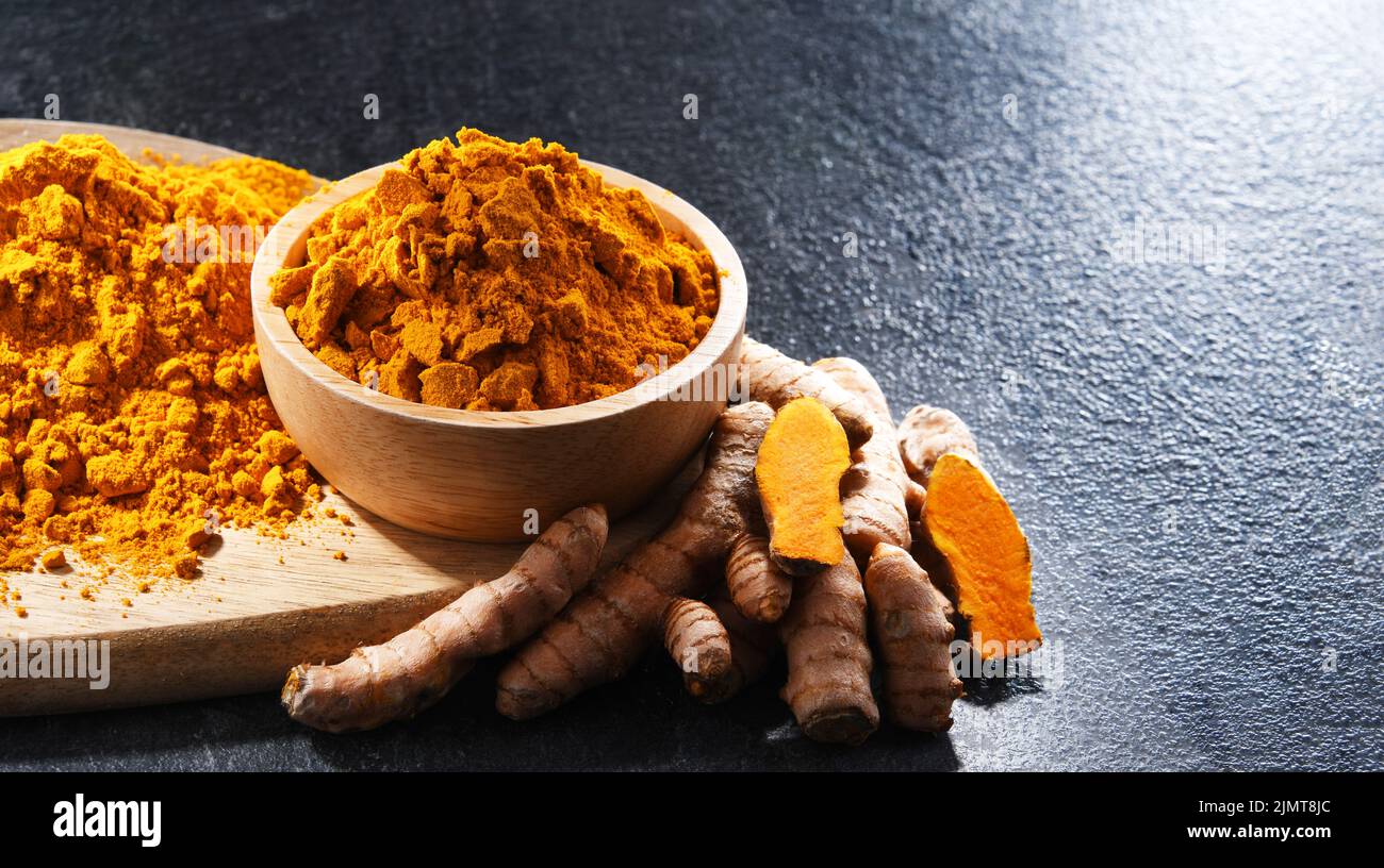 Composition with a bowl of ground turmeric and its fresh rhizome Stock ... Composition with a bowl of ground turmeric and its fresh rhizome Stock ...