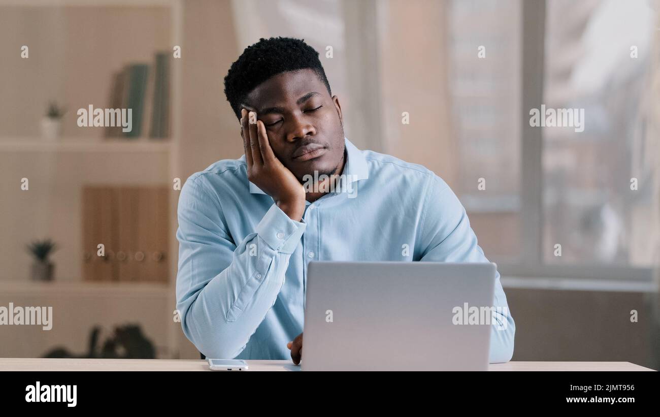 Depressed african american guy using hi-res stock photography and ...