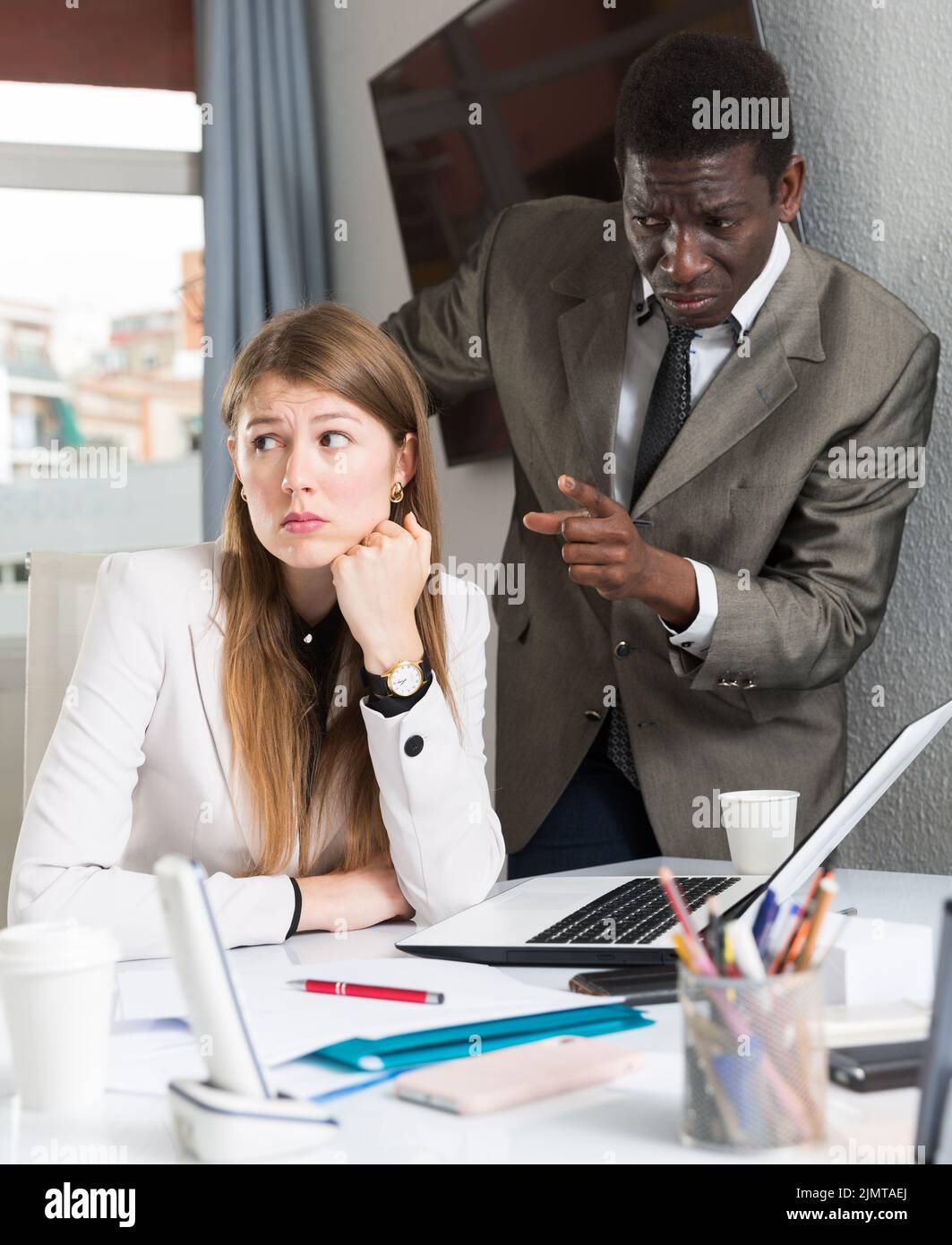 Unhappy company director scolding female hi-res stock photography and ...
