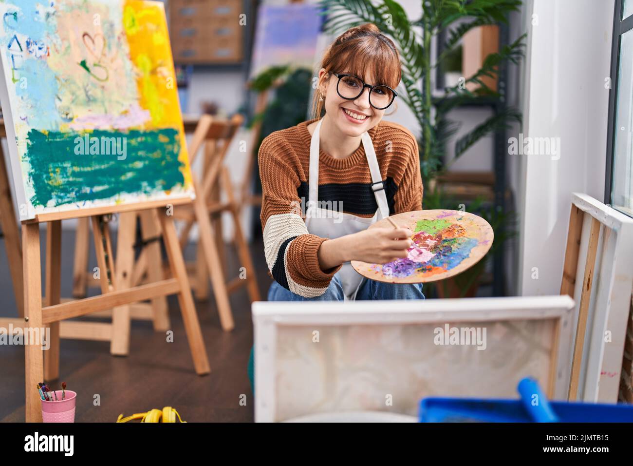 Young woman artist smiling confident drawing at art studio Stock Photo ...