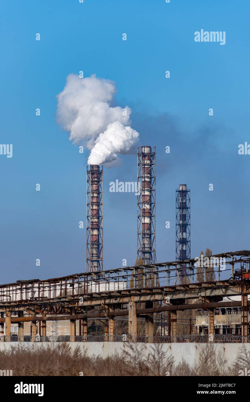 Smoke stack of coal power plant on blue sky background Stock Photo - Alamy