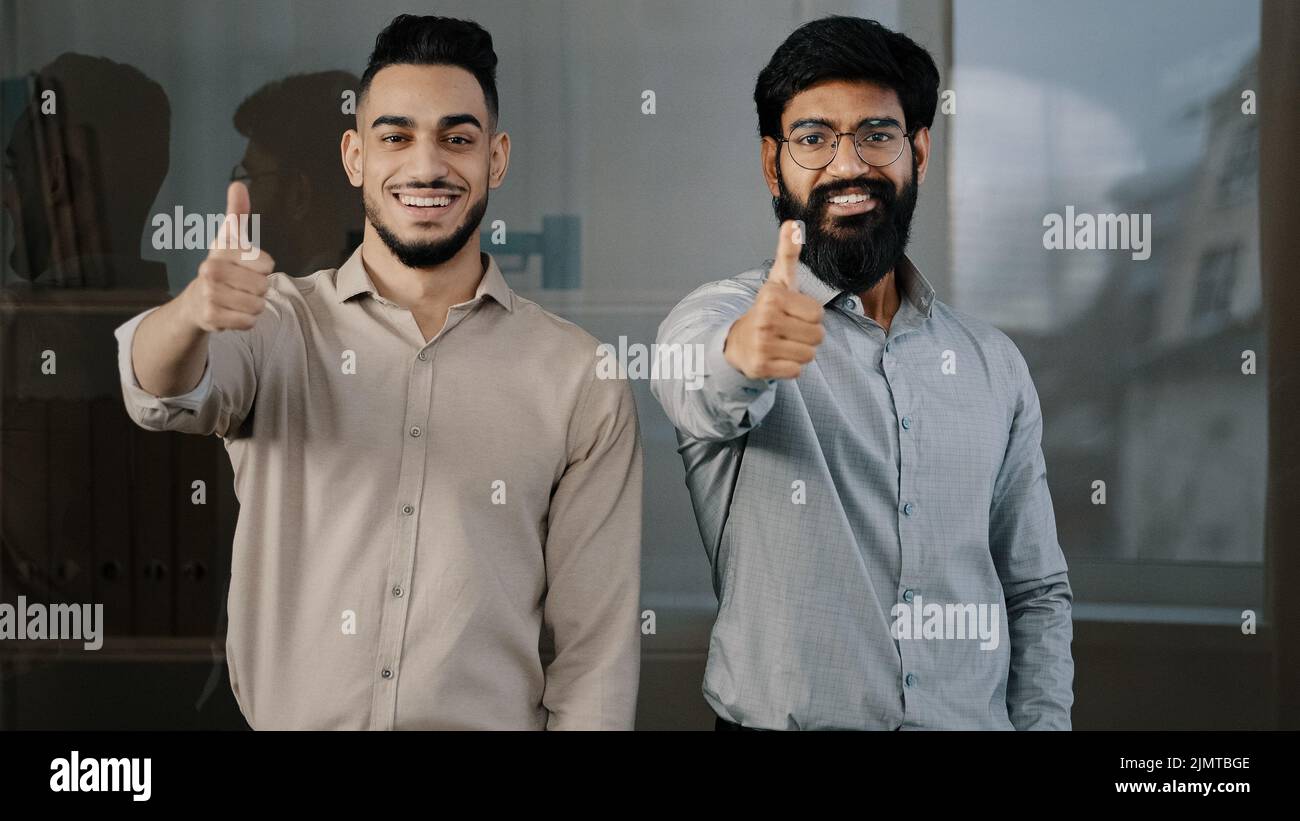 Happy confident men young professional colleagues co-workers partners ...