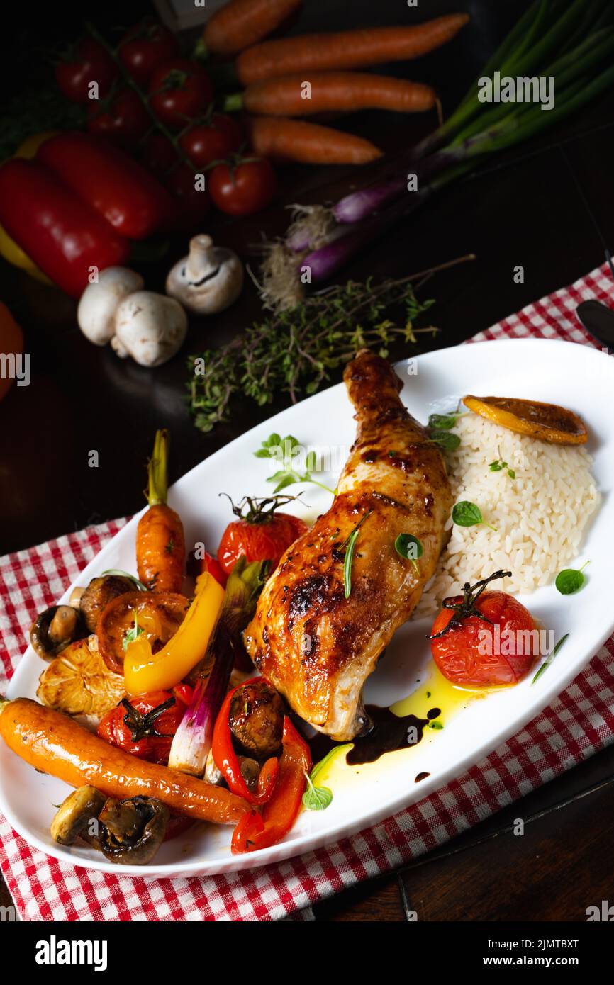 Rustic fried chicken legs with assorted vegetables and rice Stock Photo ...