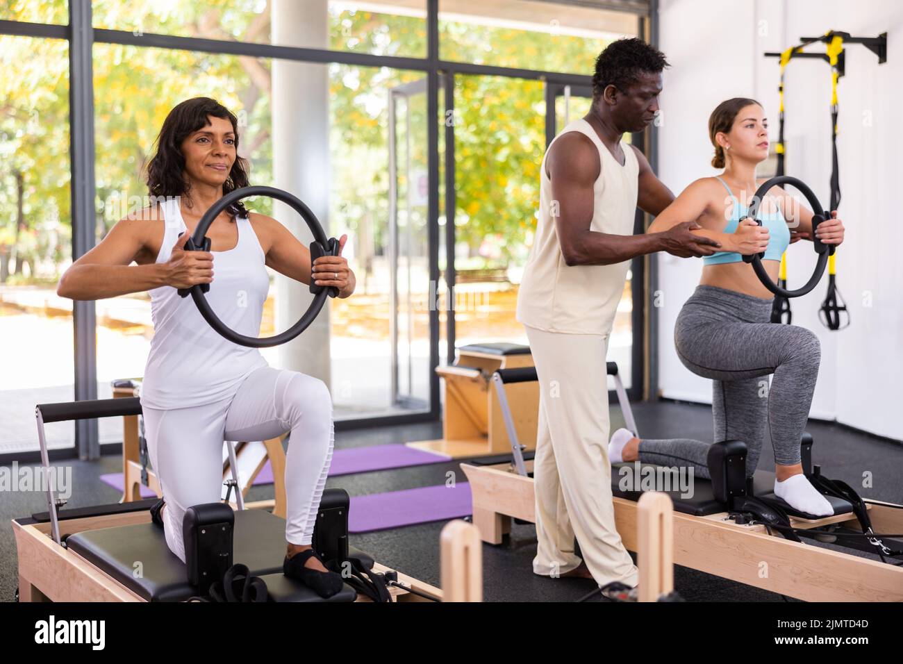 Healthcare professional helps an man restore health with gymnastic ring ...