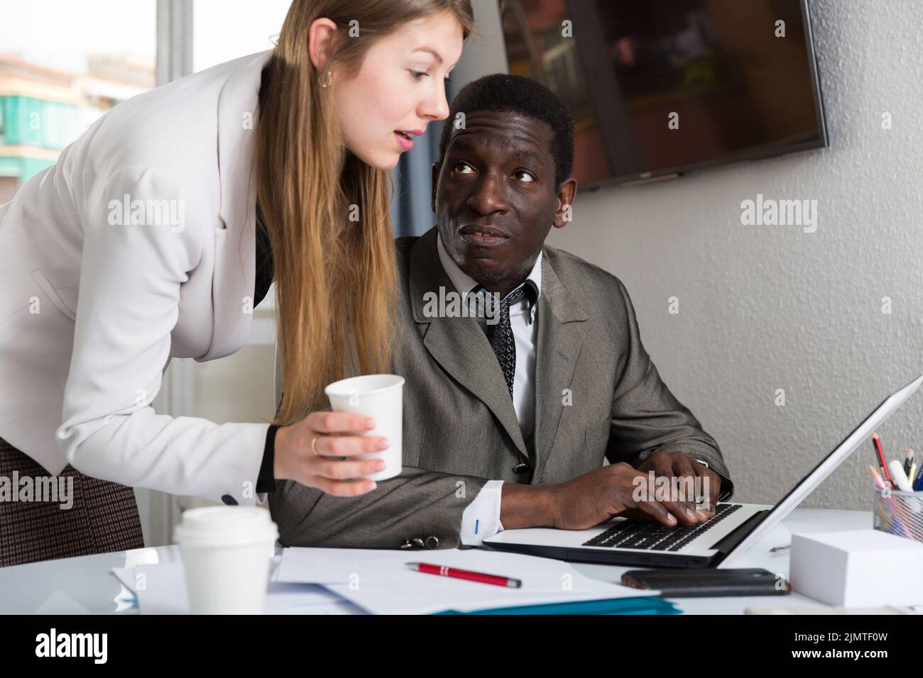 Male manager helping colleagues project hi-res stock photography and ...