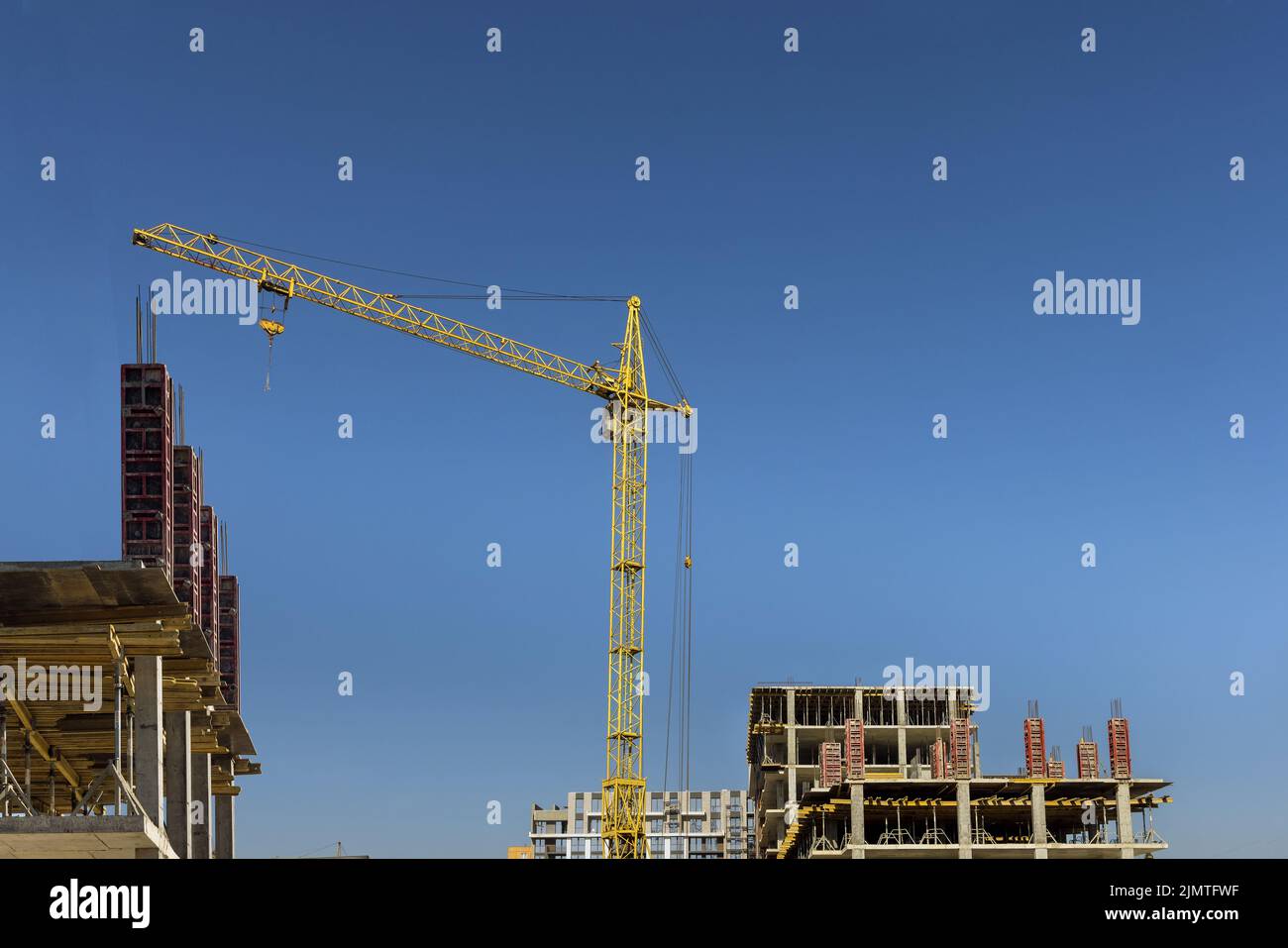 A multi-storey apartment building is being constructed using tower ...