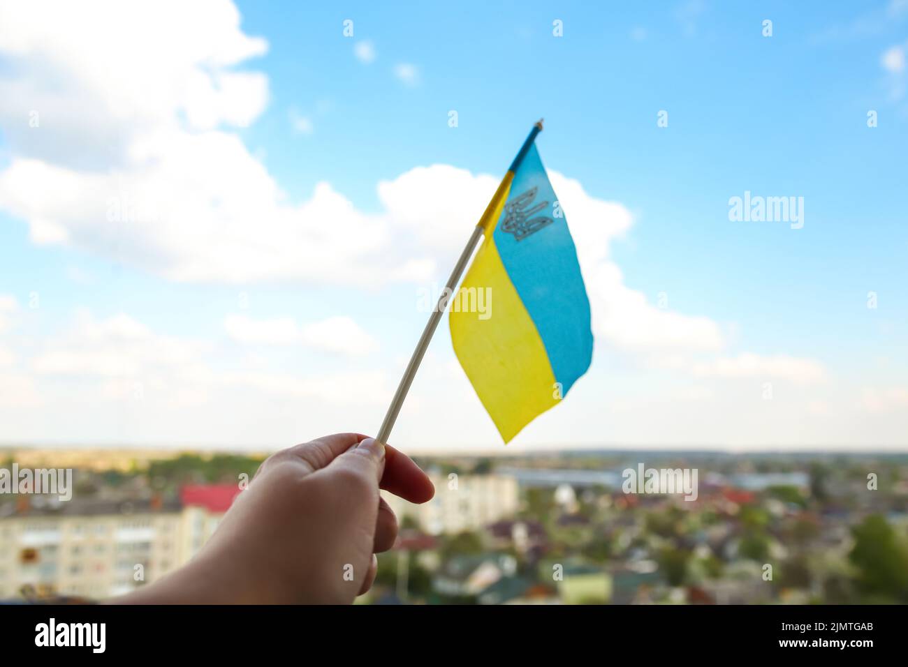 Defocus Ukraine Flag Large National Symbol Fluttering In Blue Sky Support And Help Ukraine defocus-ukraine-flag-large-national-symbol-fluttering-in-blue-sky-support-and-help-ukraine