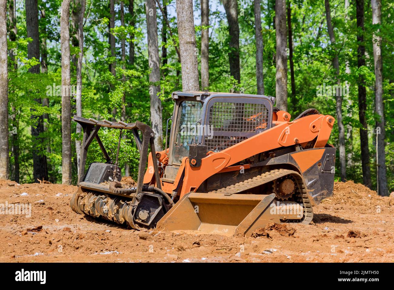 A construction industrial grader carries out the process of leveling ...