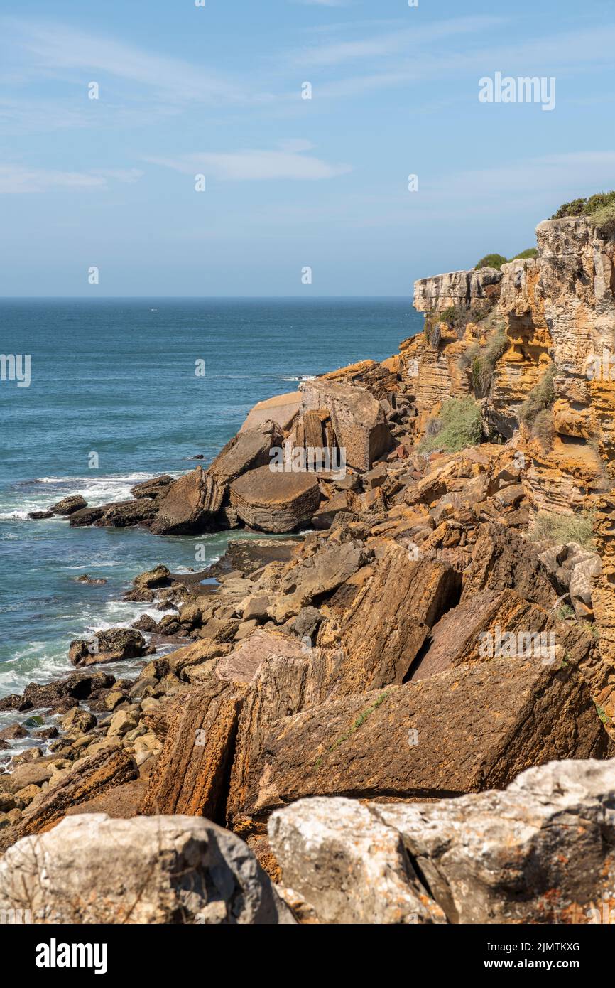 Nice brownstone cliffs on the Portuguese Atlantic coast on a warm ...