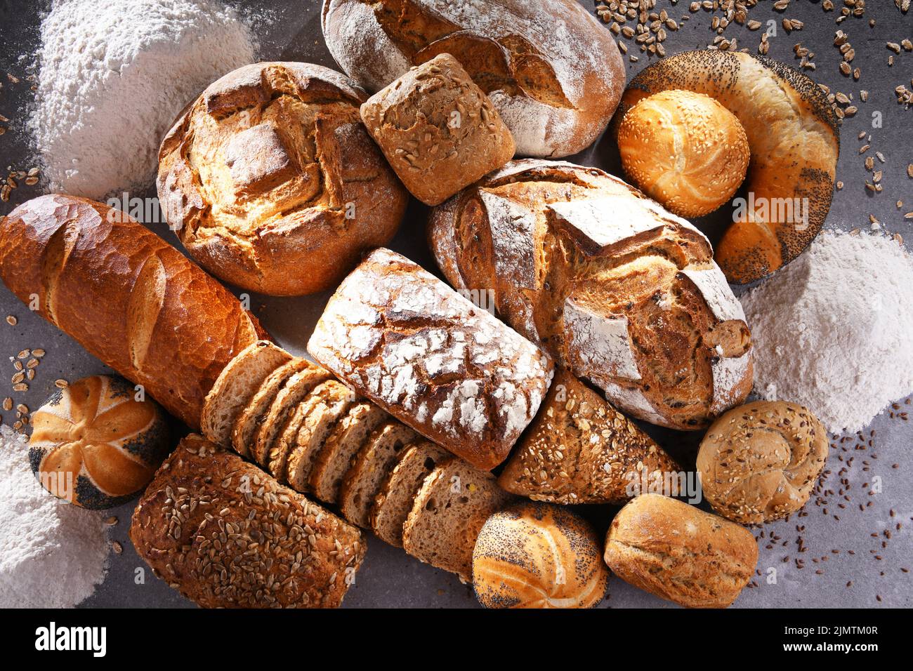 Assorted bakery products including loafs of bread and rolls Stock Photo ...