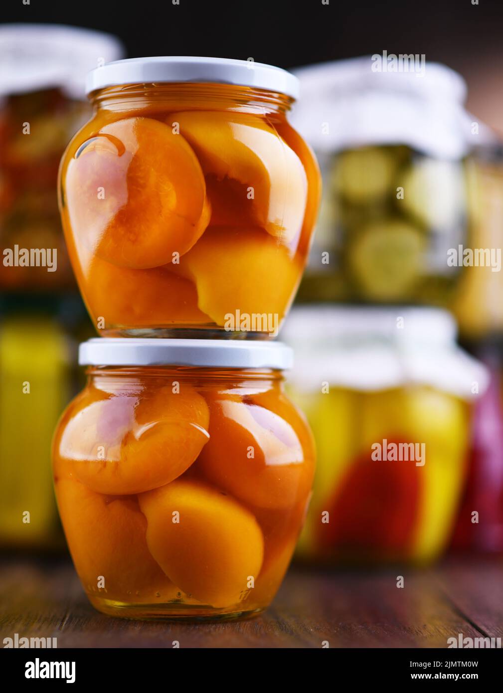 Jars with variety of marinated vegetables and fruits. Preserved food ...