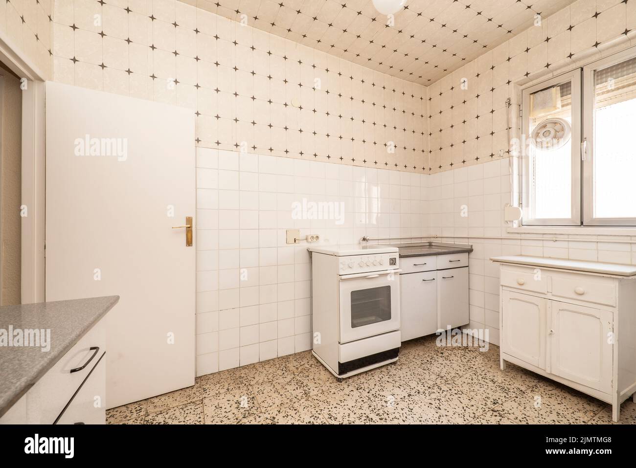 Vintage kitchen with white tiles on the wall, ceiling with decorative ...