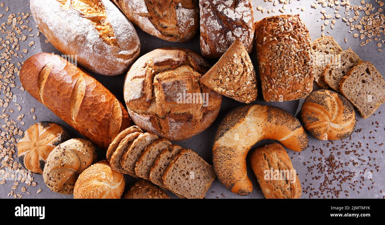 Assorted bakery products including loafs of bread and rolls Stock Photo ...
