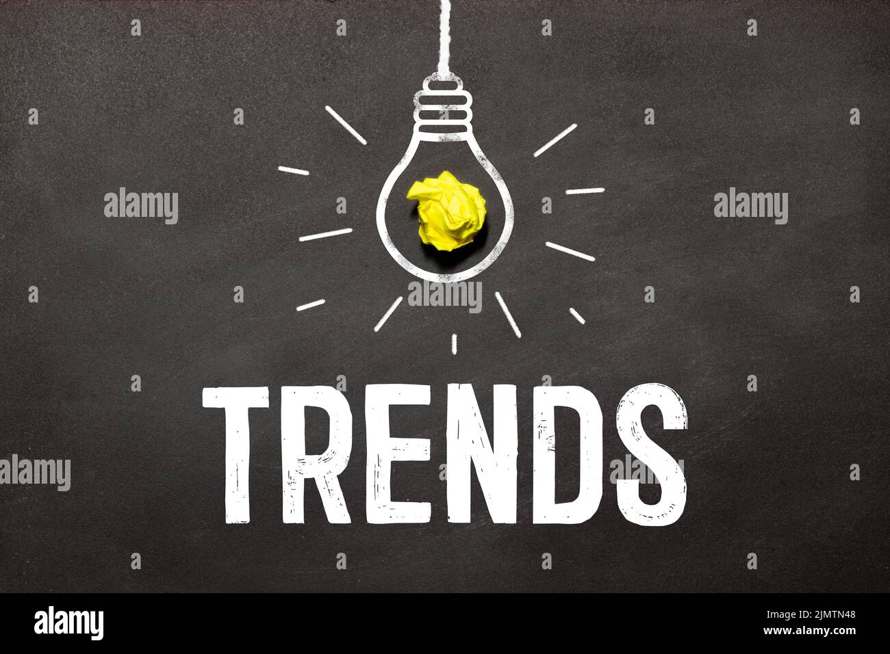 The word TRENDS written in vintage metal letterpress type on a soft ...