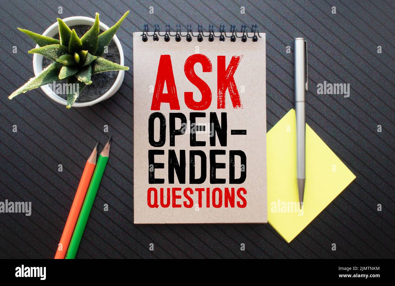 Ask Open-Ended Questions written on a notebook page, pencil on the left ...