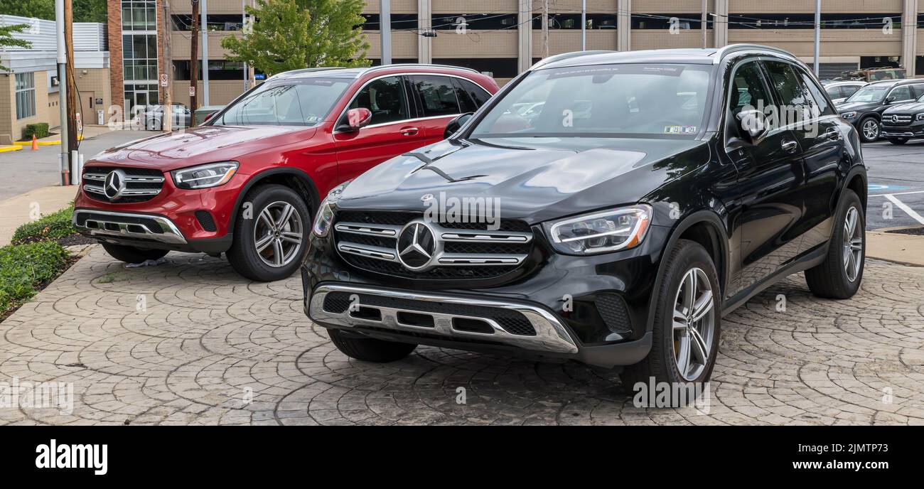 Two different Mercedes Benz vehicles together at a dealership in ...
