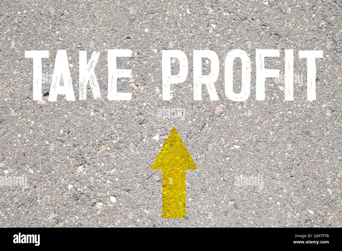 Business concept. On the asphalt road markings an arrow with the ...