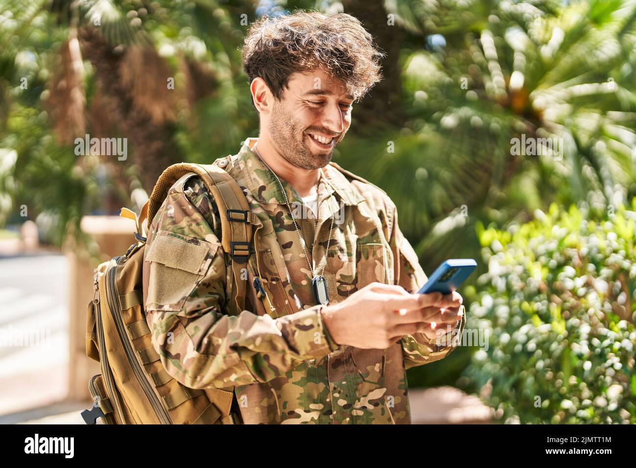 Happy military man using smartphone hi-res stock photography and images ...